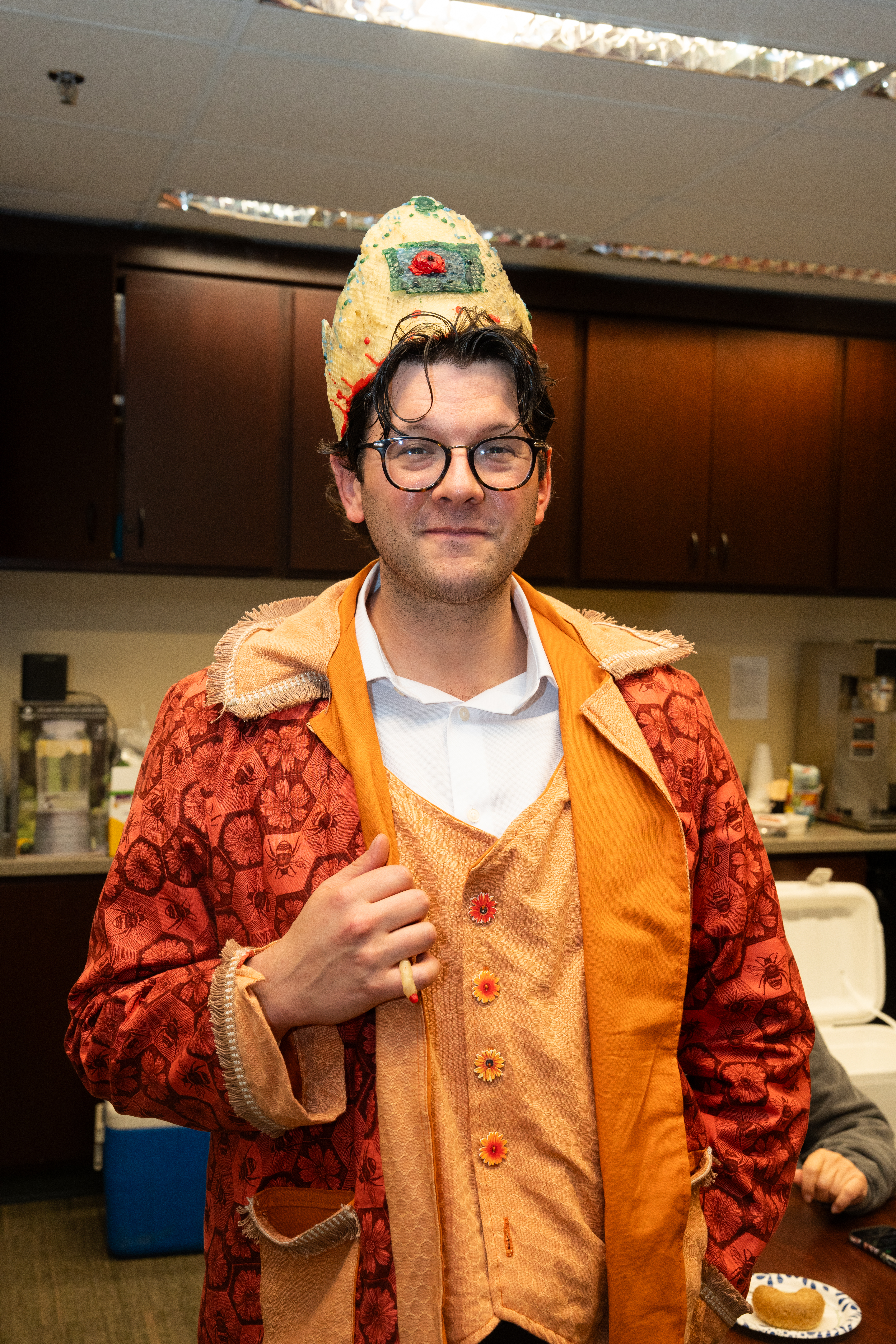 Man in costume at Spring Fest. He wears a floral jacket, vest, and ...