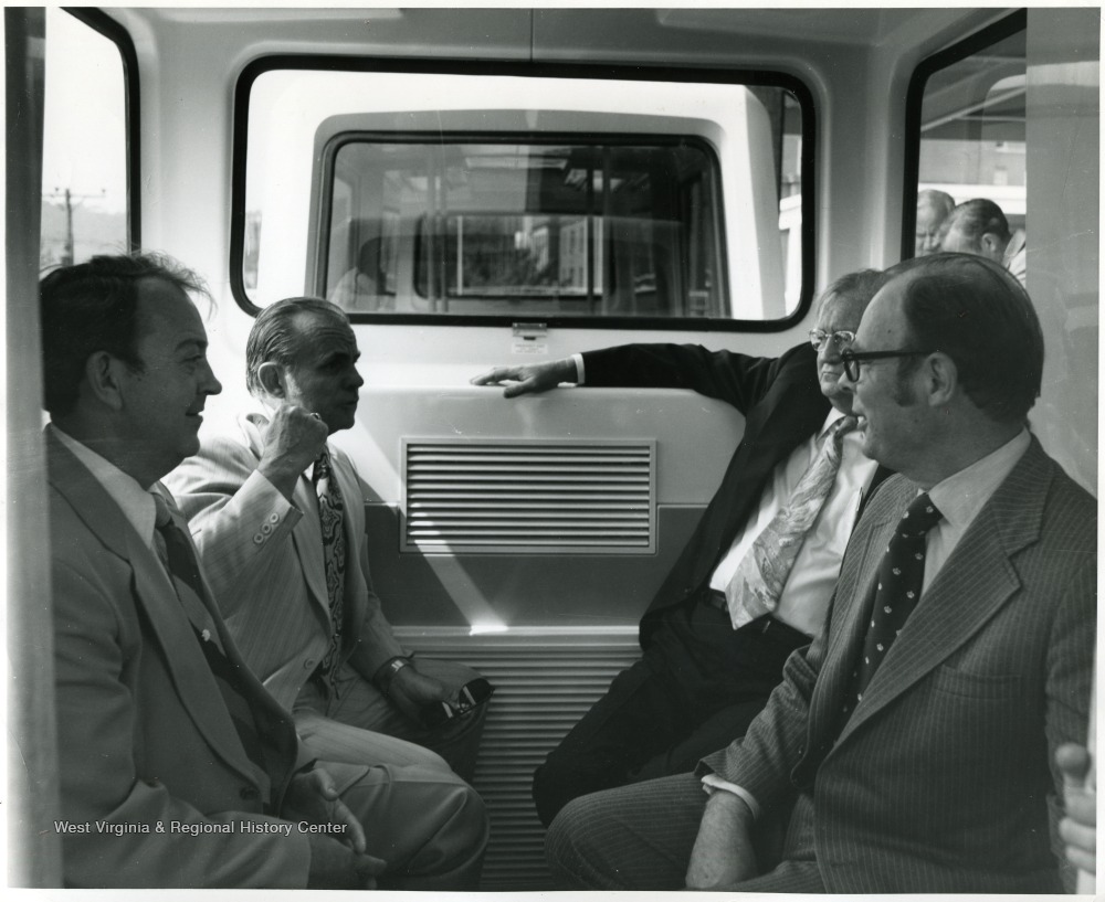 WVU officials take the PRT for a spin in its early days.