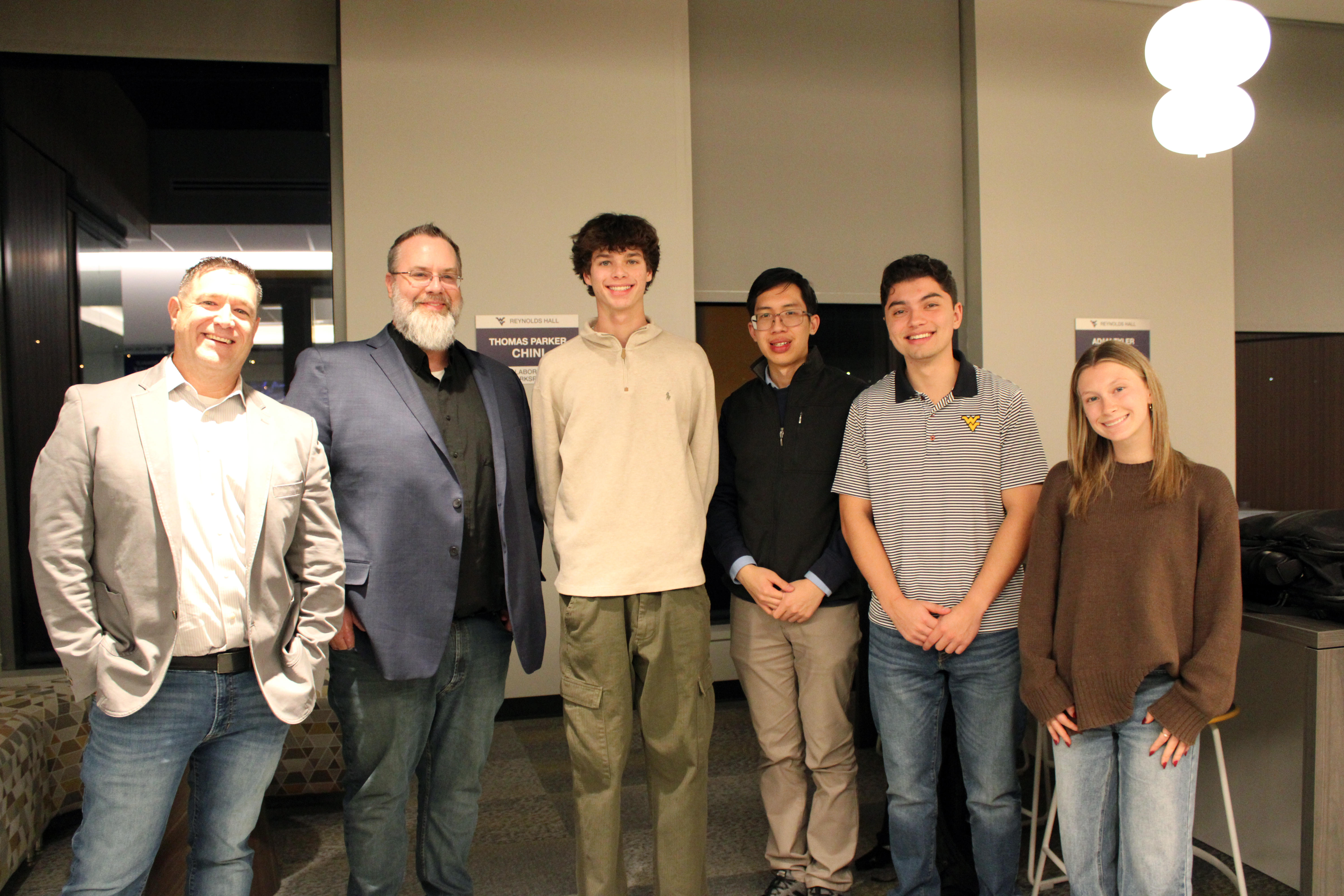 Ethan Weaver is part of a group photo with the Management Information ...