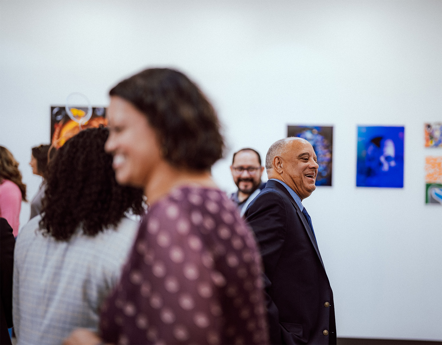 People explore the new student art exhibit space inside the Media Arts ...