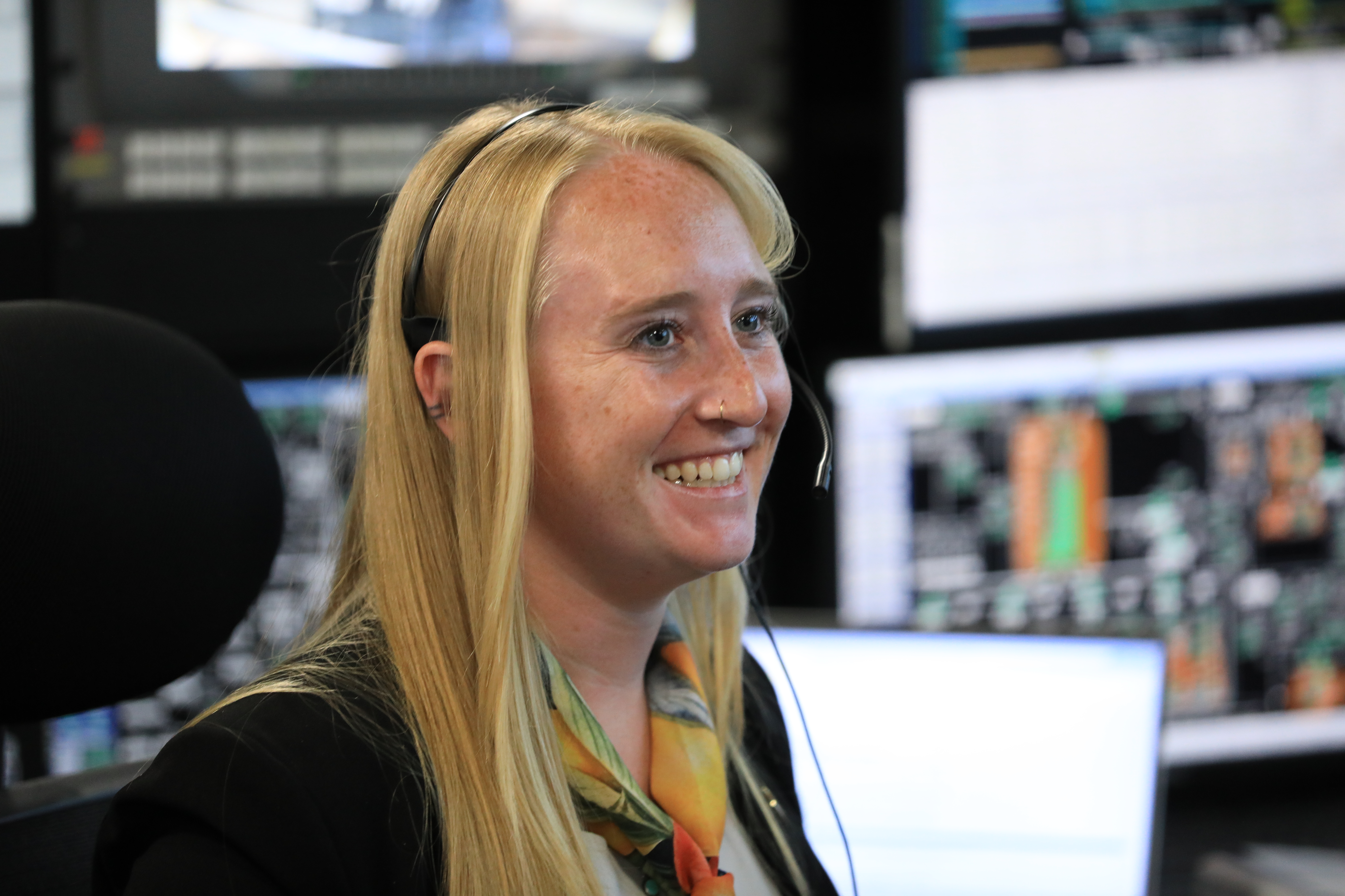 Eleanor Kearney, WVU alum and NASA engineer, smiles wearing a headset ...