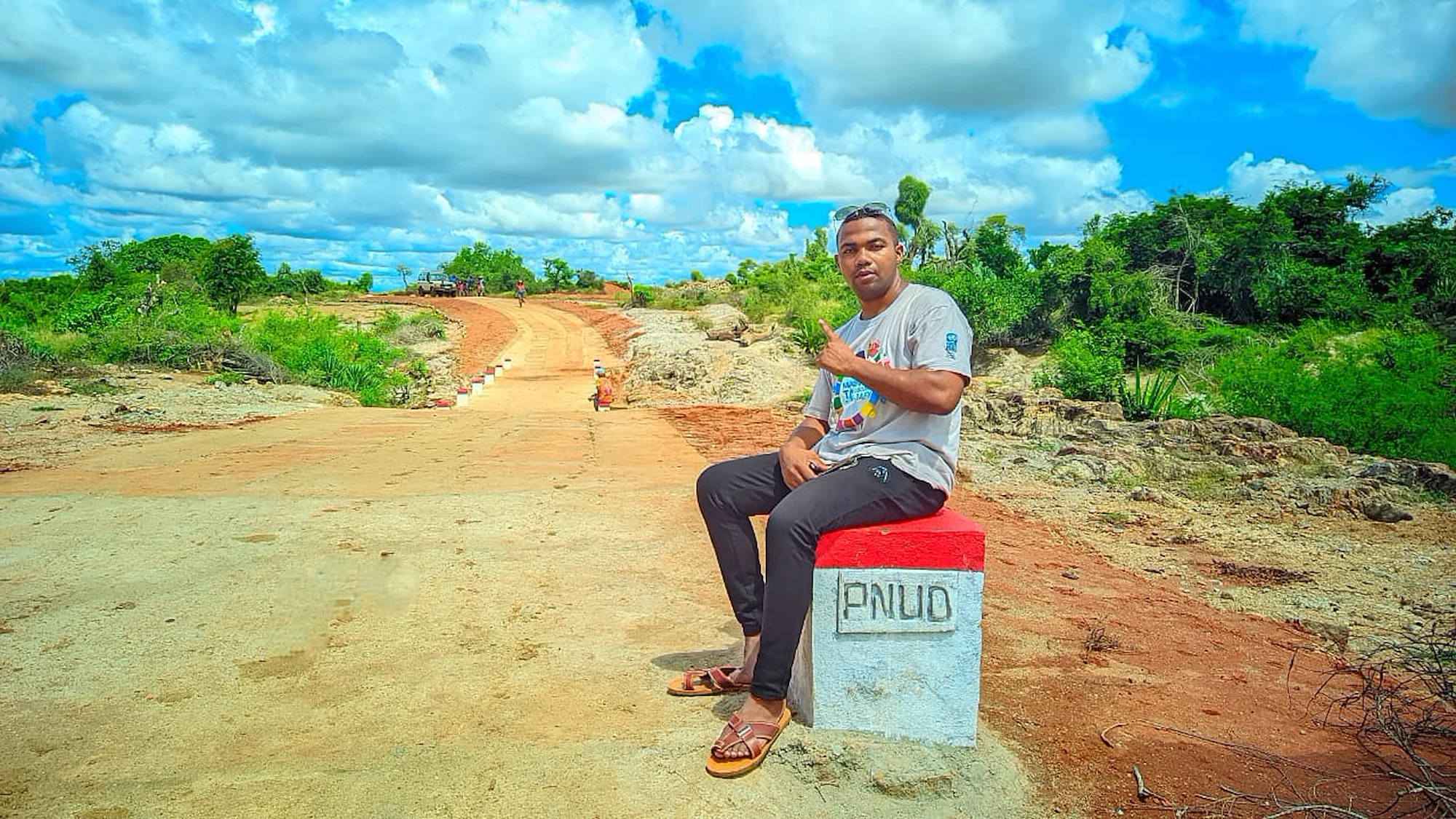 Alex Georges sitted at a bridge constructed by UNDP in Belindo town in ...