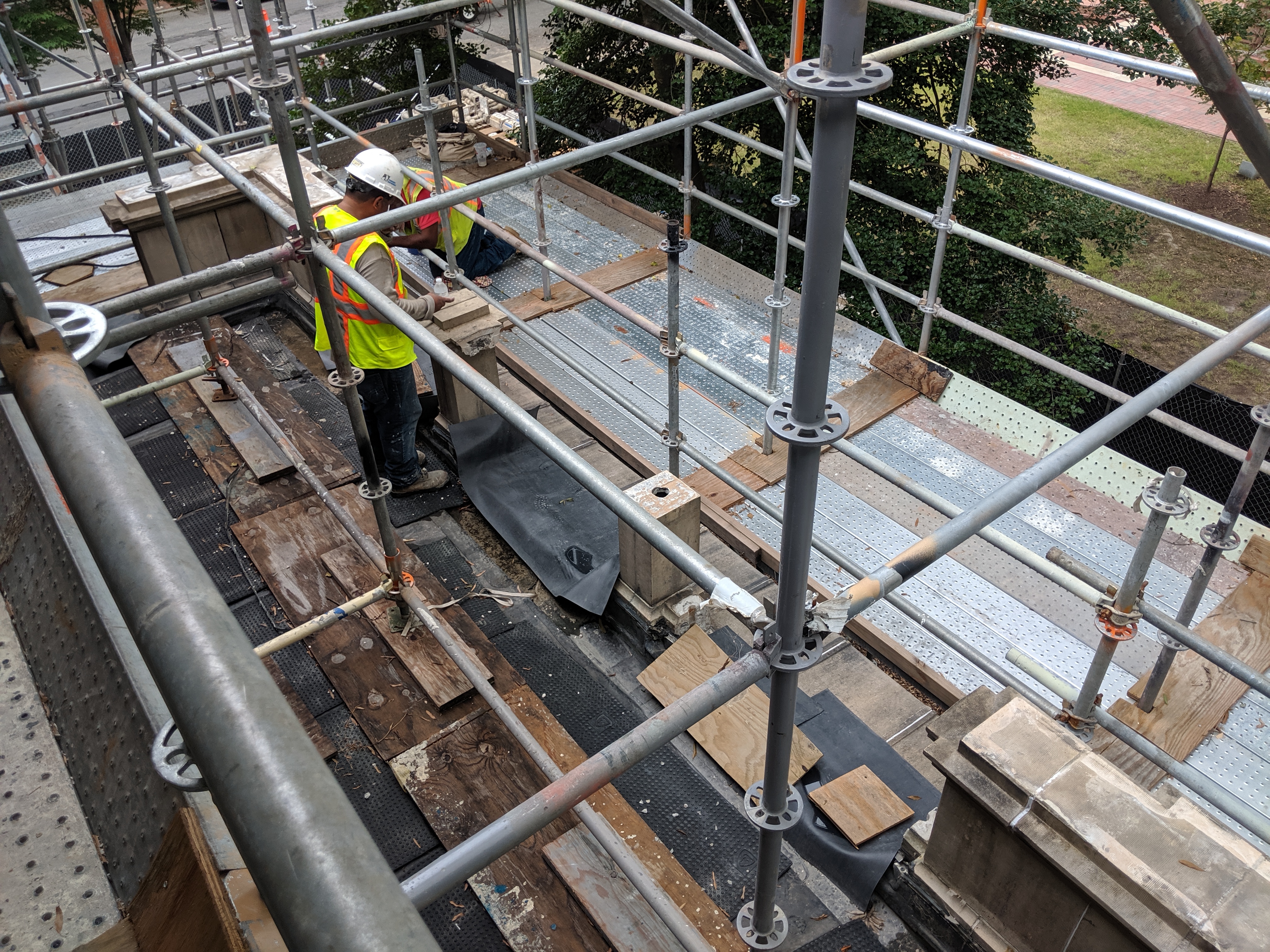 construction workers restoring the roof at the Scott House