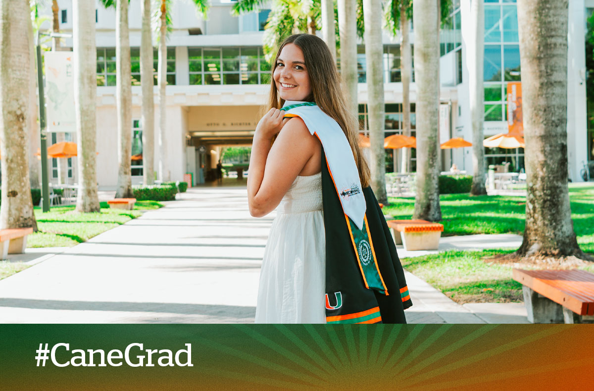 Margaret Todd, a Cane Graduate, smiles over her shoulder, wearing a ...