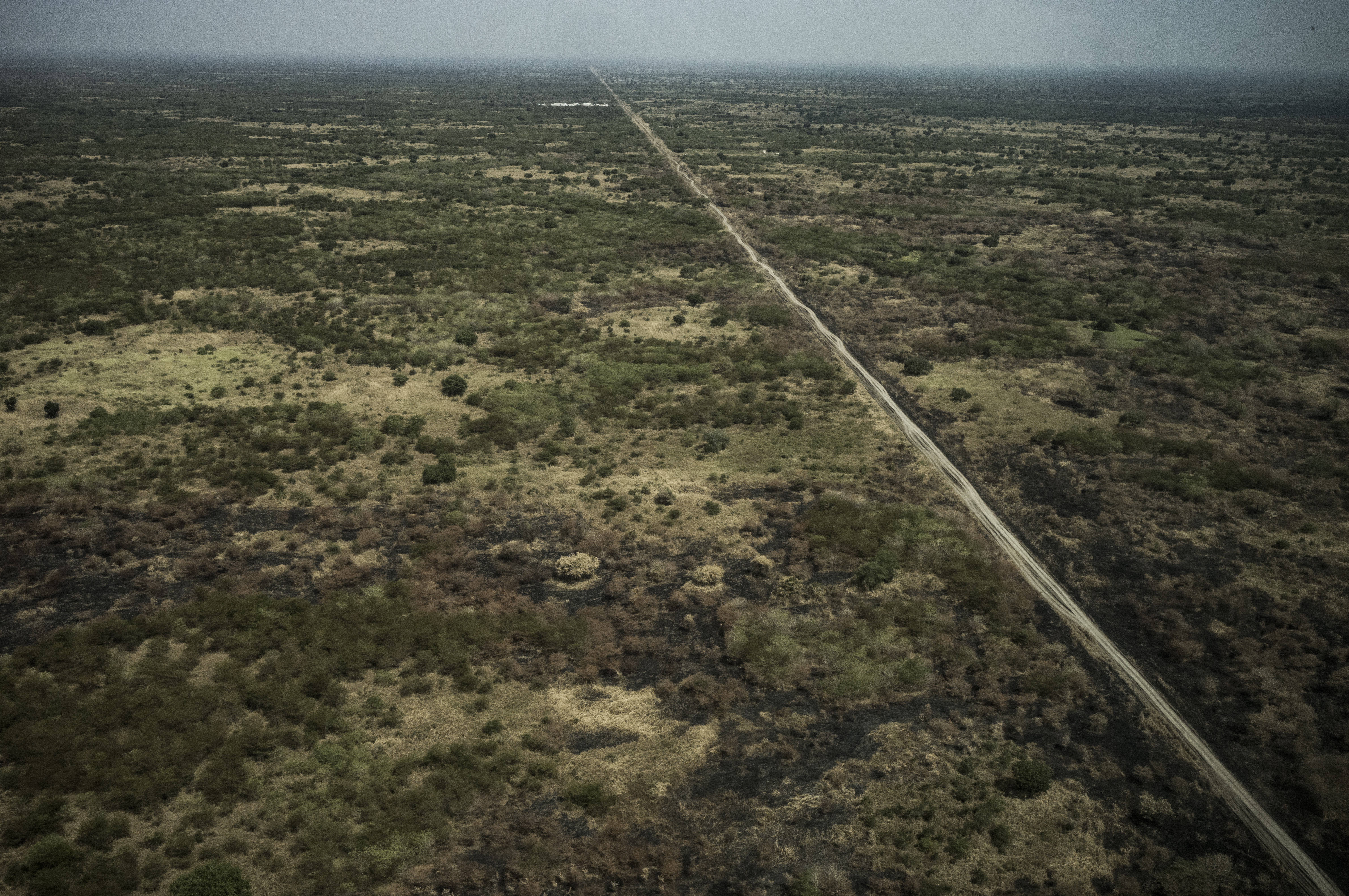 The road that links Abyei to Mayen-Abun cuts a thin, unwavering line ...