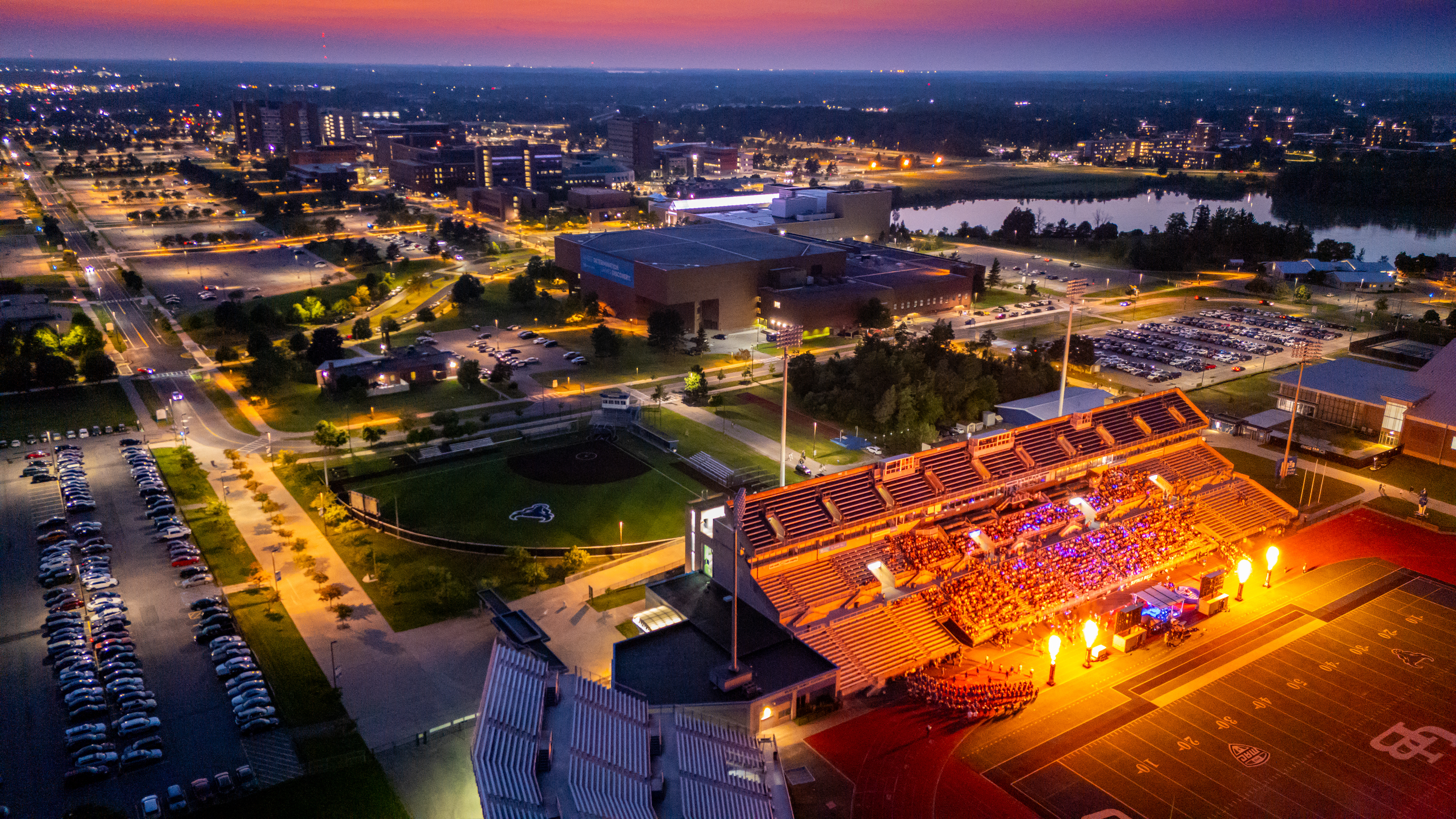 A aerial perspective of a bash in a stadium, with fireworks on the ...