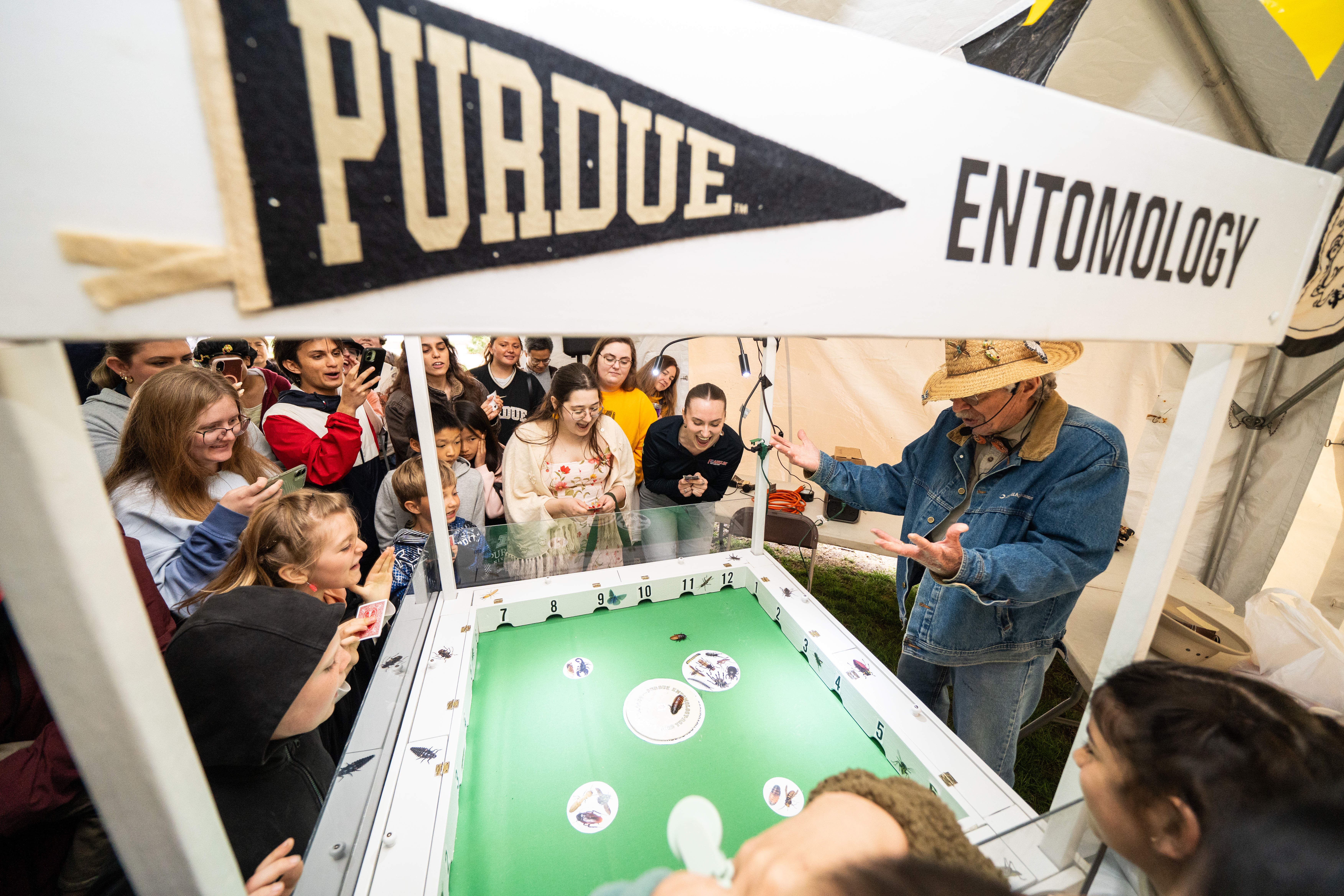 At Spring Fest 2026, a Purdue Entomology booth attracts a crowd. An ...