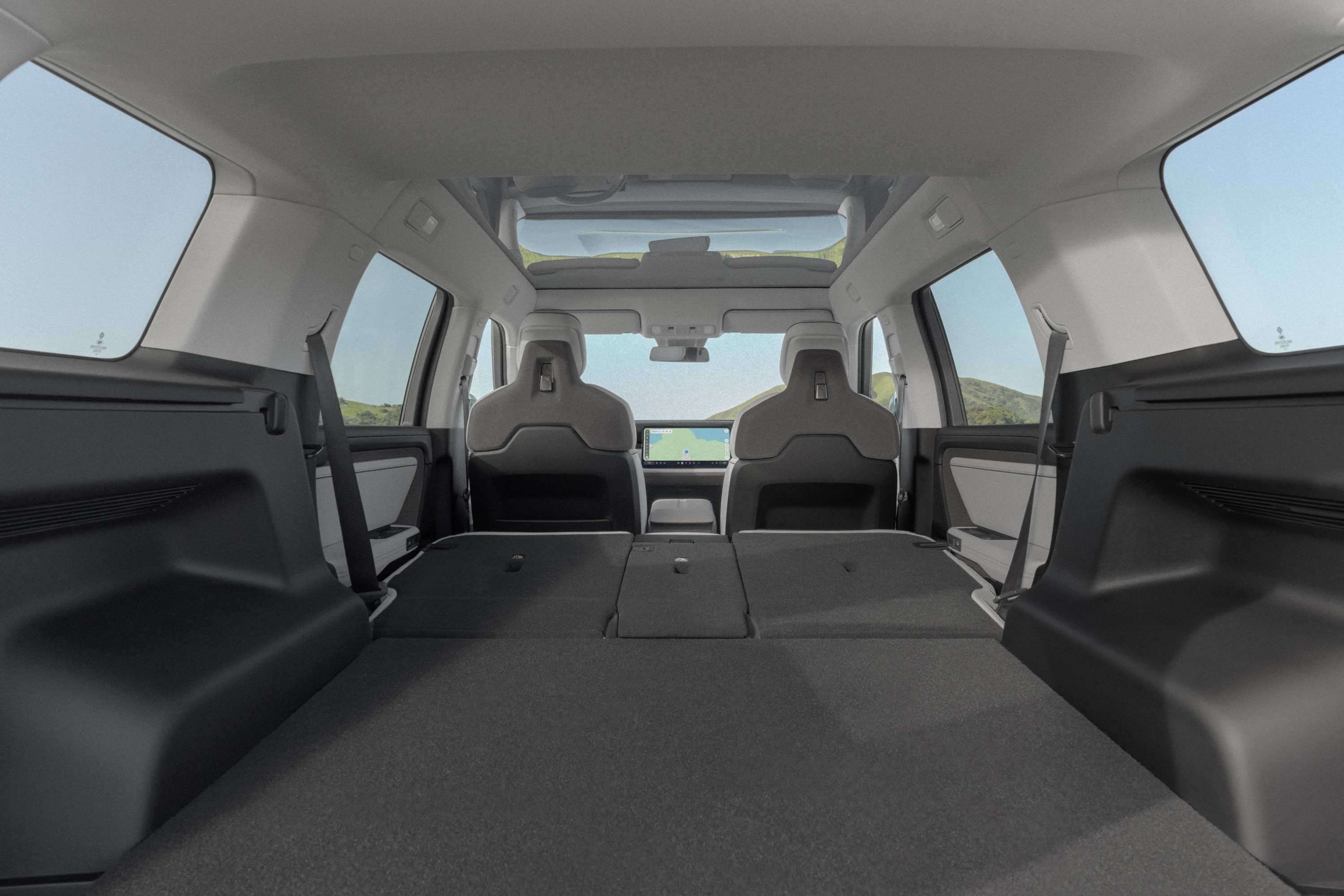 The interior of R2 is seen from the back, showing folded seats and a ...