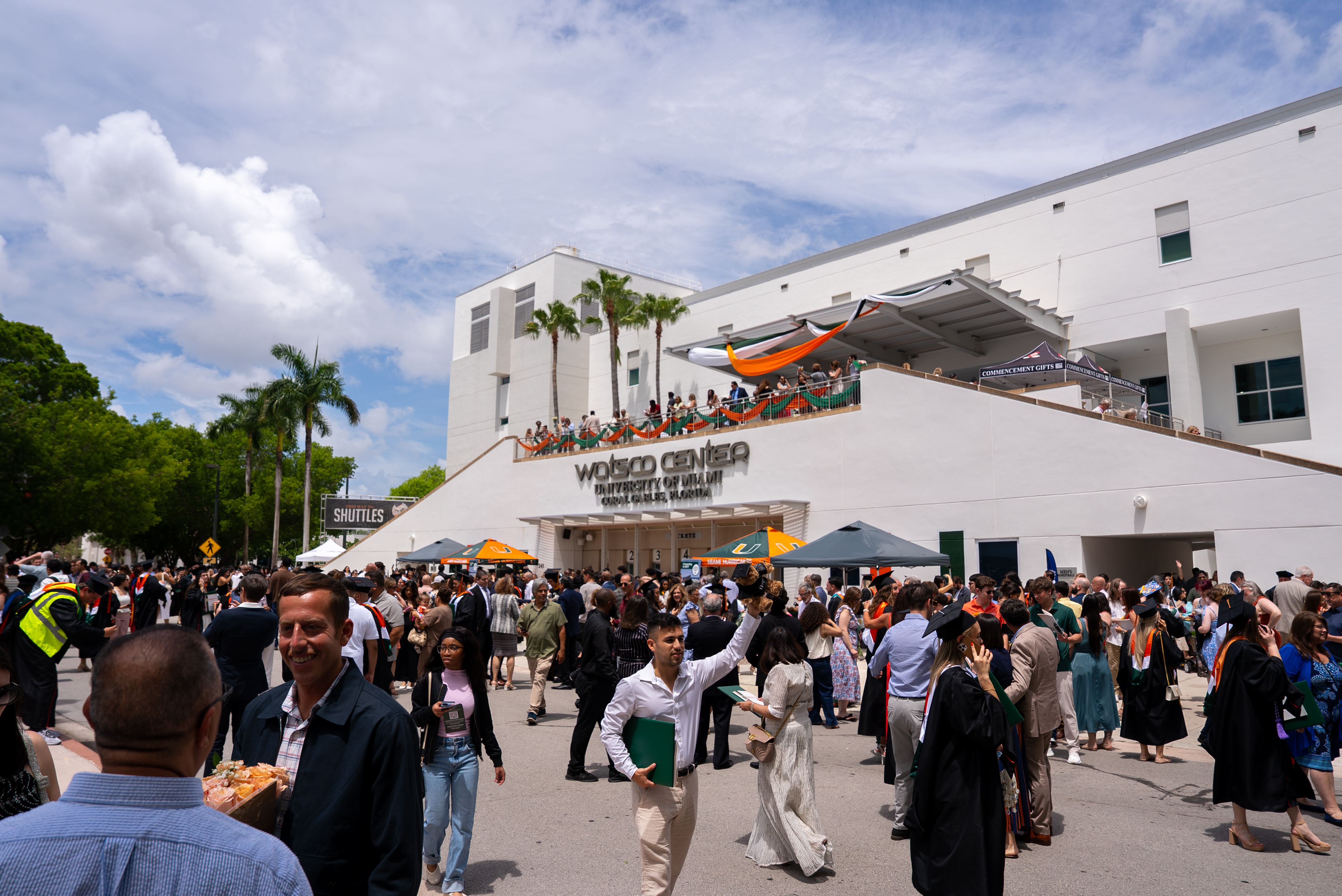 Graduates and families gather outside the Watsco Center, University of ...